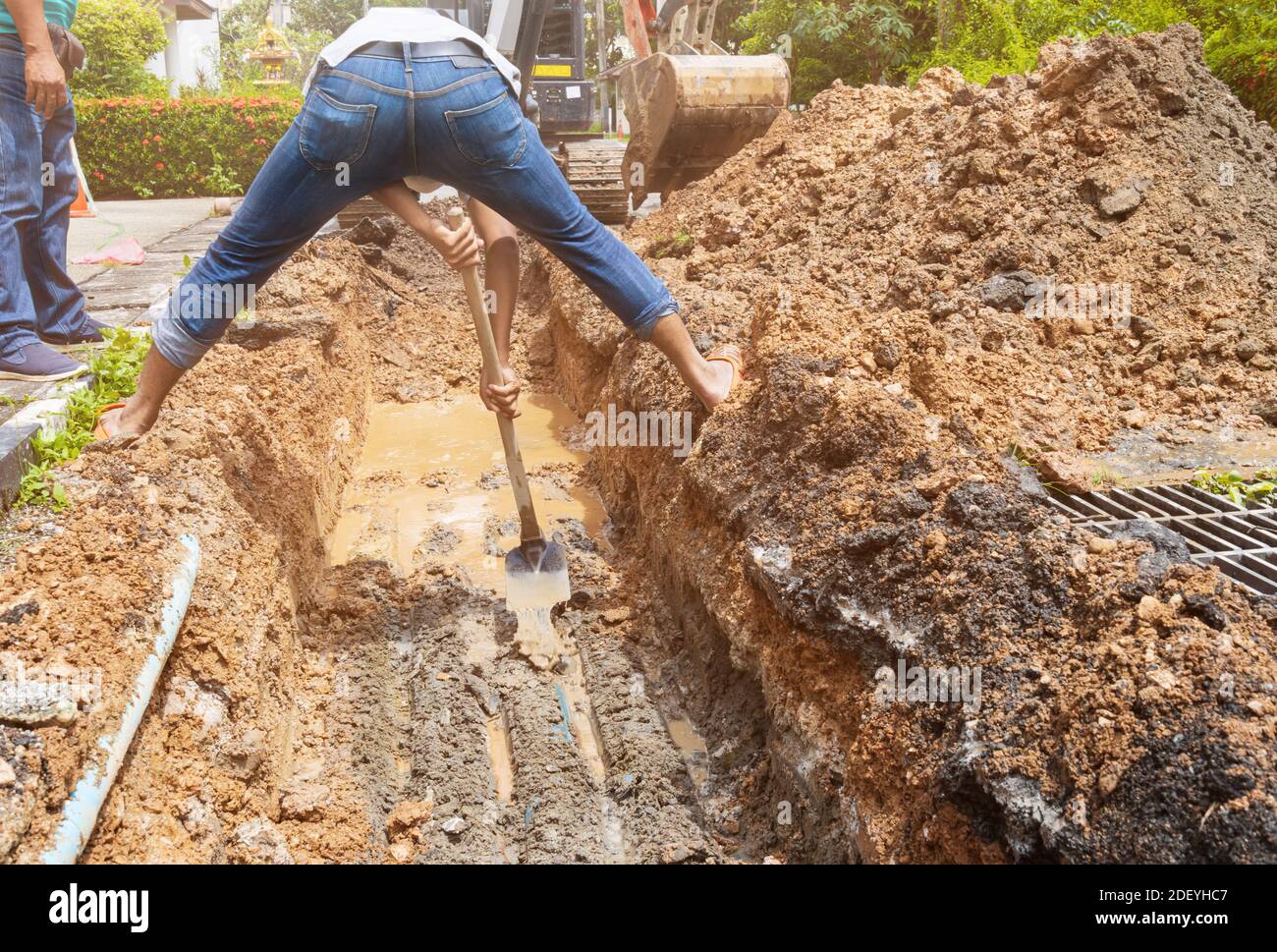 plumber work dig repair water line connect PVC pipe main plumbing on ...