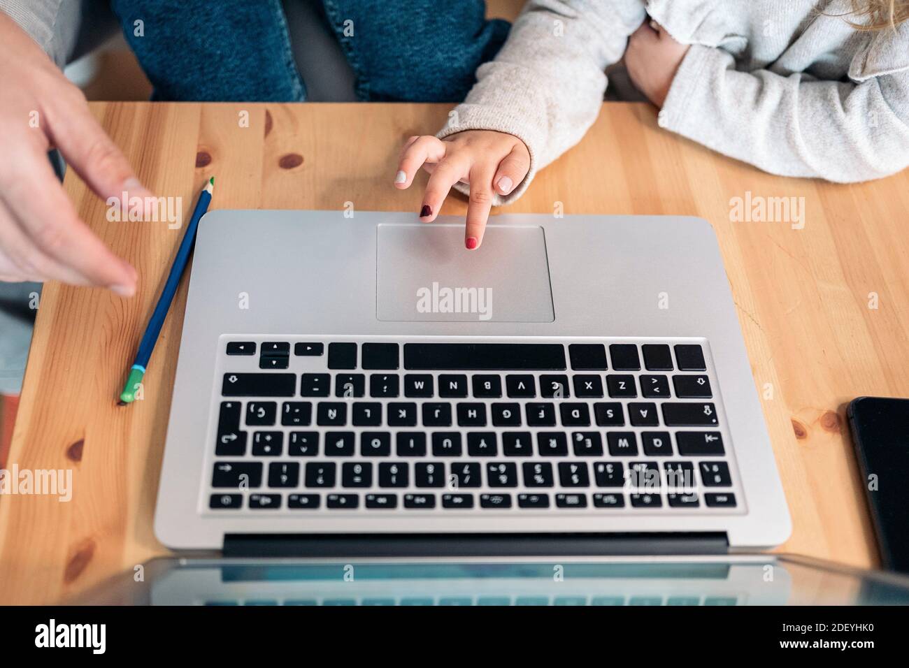 Stock photo of unrecognized girl with painted nails using computer ...