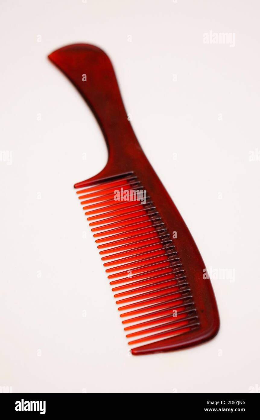 A vertical shot of a new comb isolated on a white surface Stock Photo ...