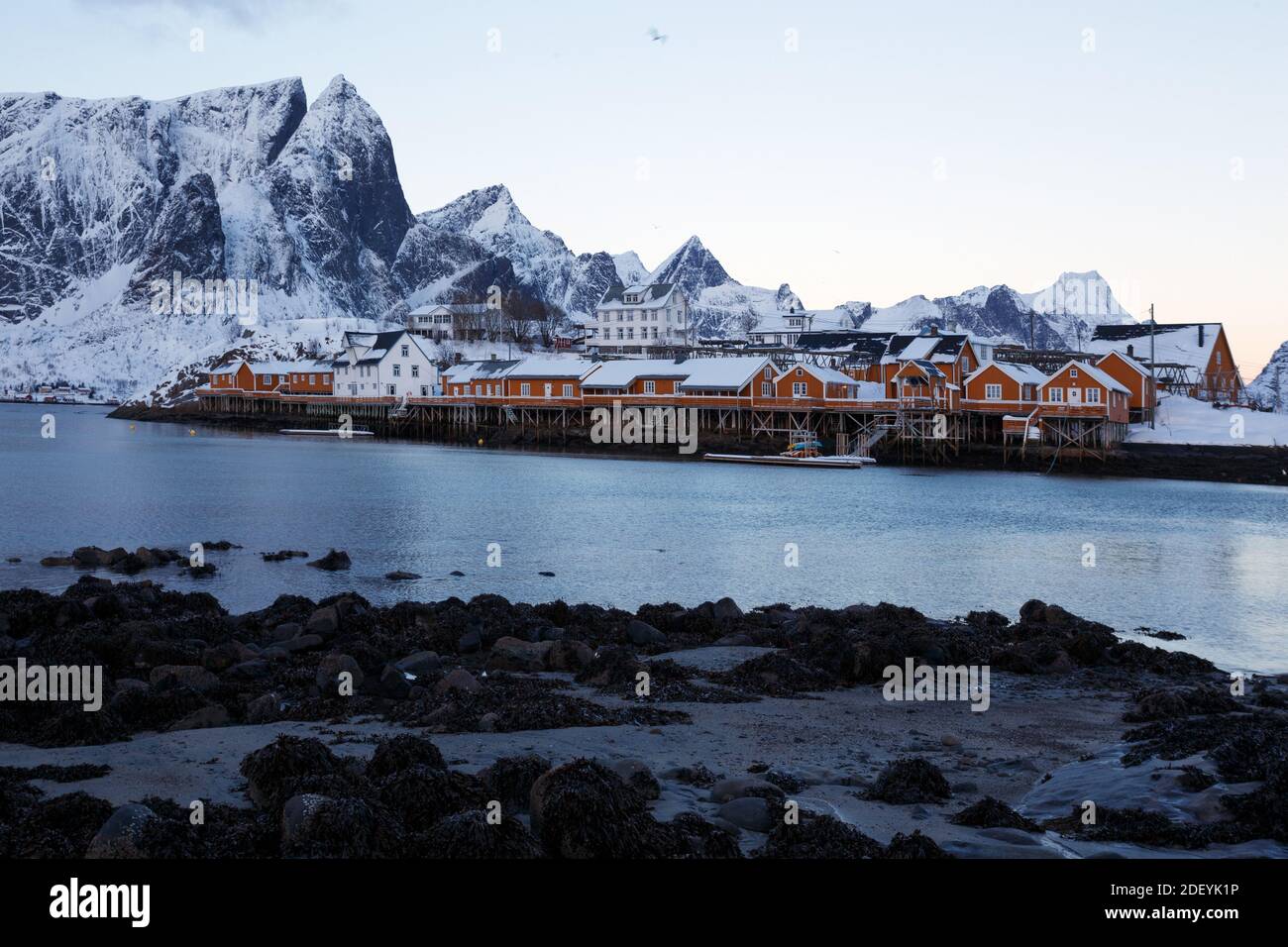 traditional norwegian wooden house rorbu to stand on the shore of the ...