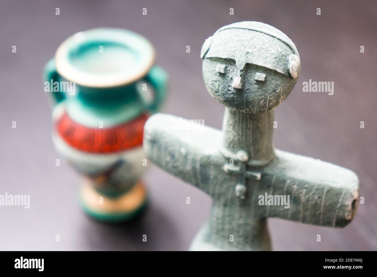 A close up shot of an old cross symbol of Cyprus on a blurred ...