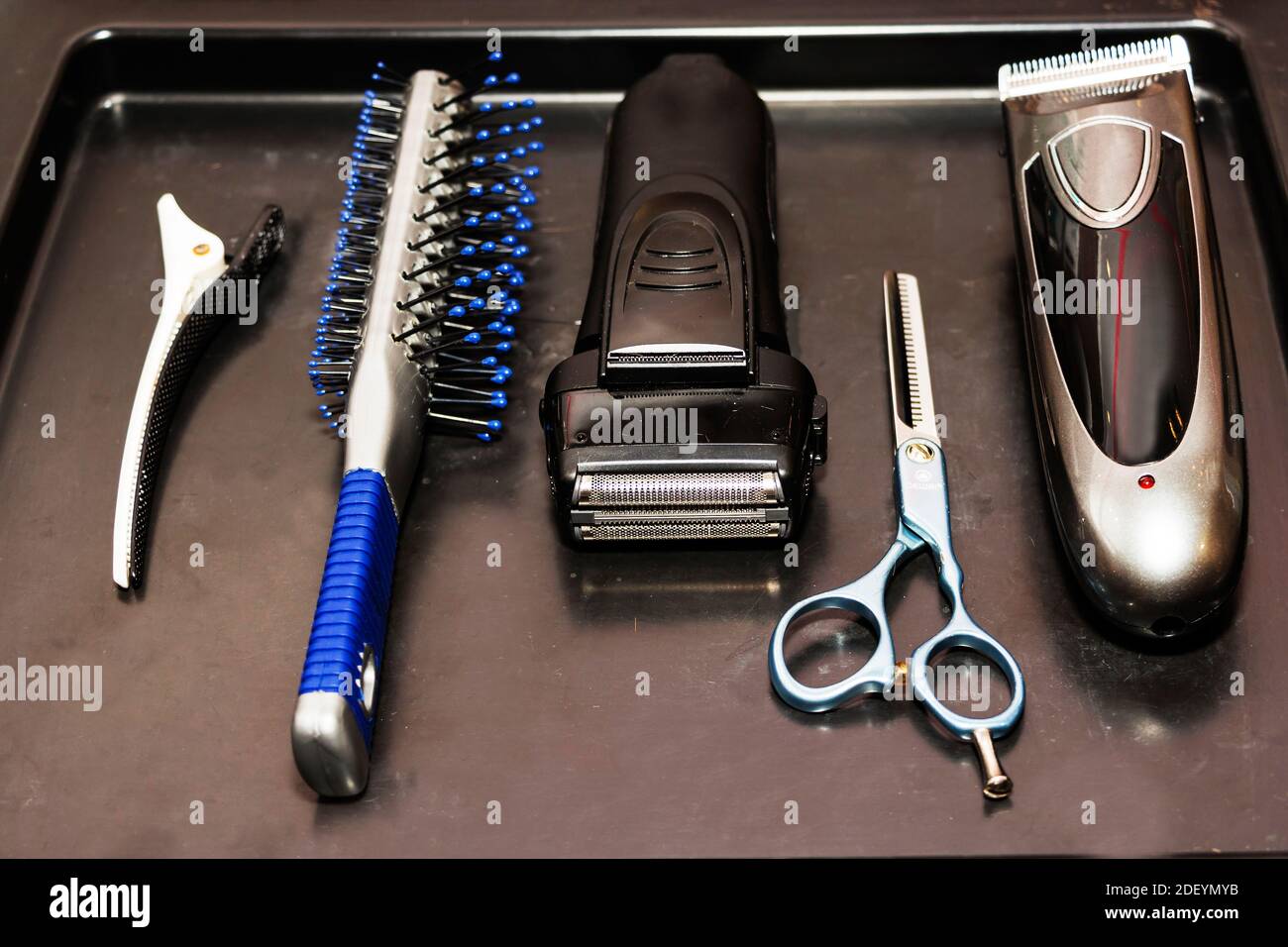 professional tools of hairdresser in black case Stock Photo - Alamy