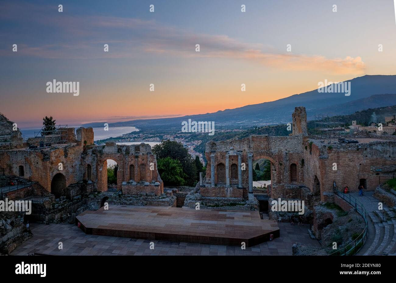 Ruins of Ancient Greek theatre in Taormina on background of Etna ...