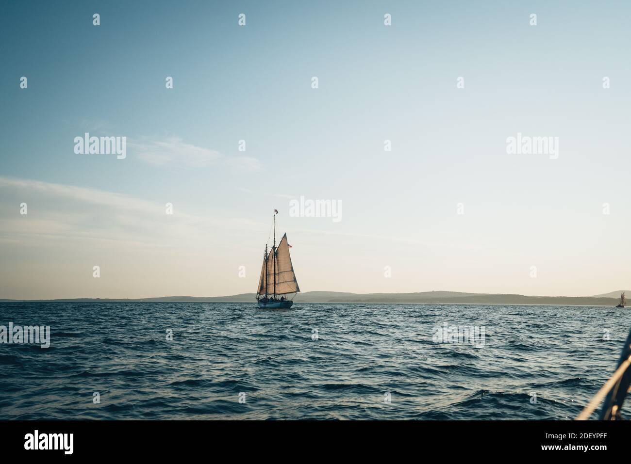 A schooner sailing in The West Penobscot Bay, Maine during late day ...