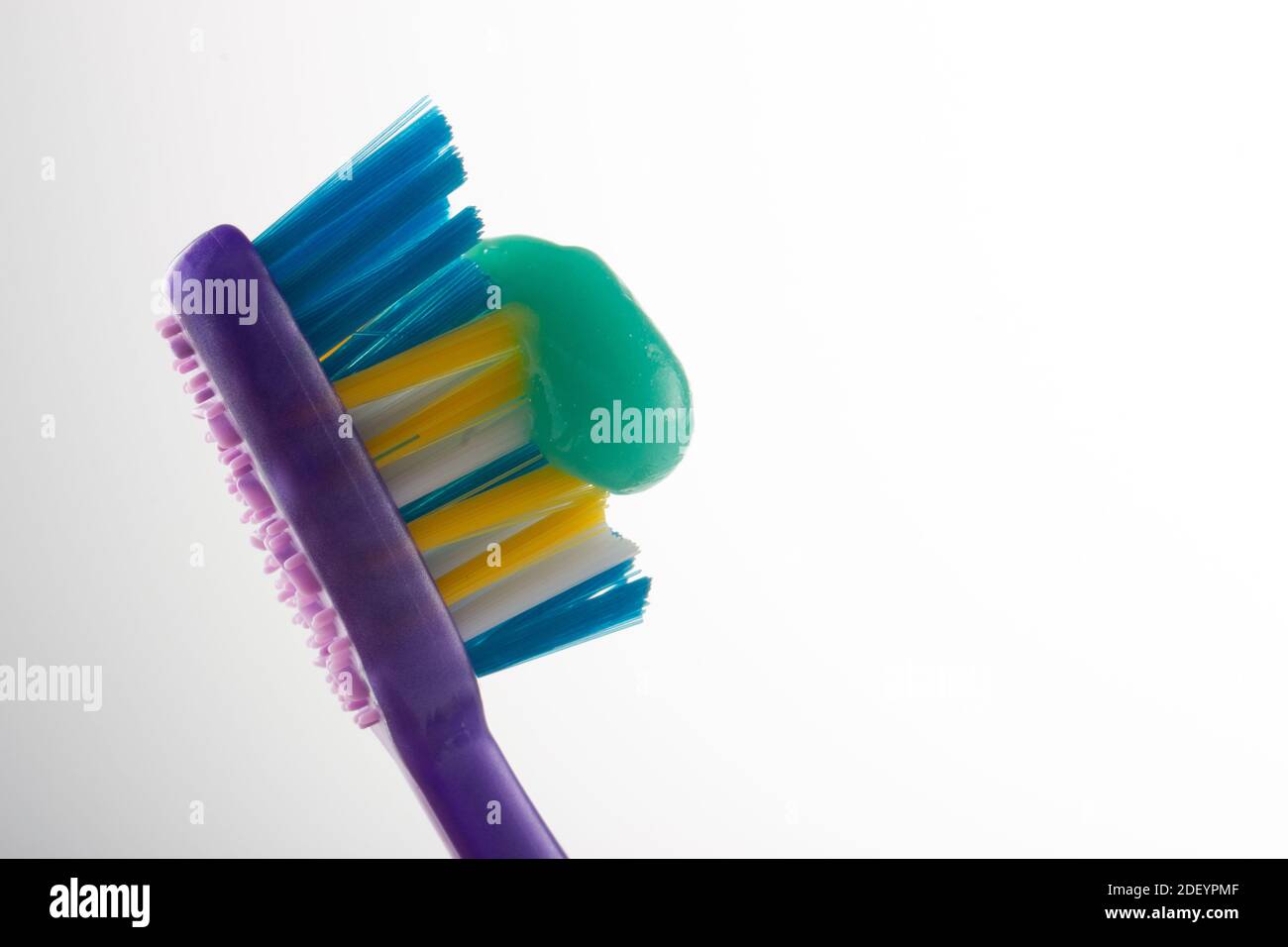 Toothpaste on a toothbrush on a white background Stock Photo - Alamy