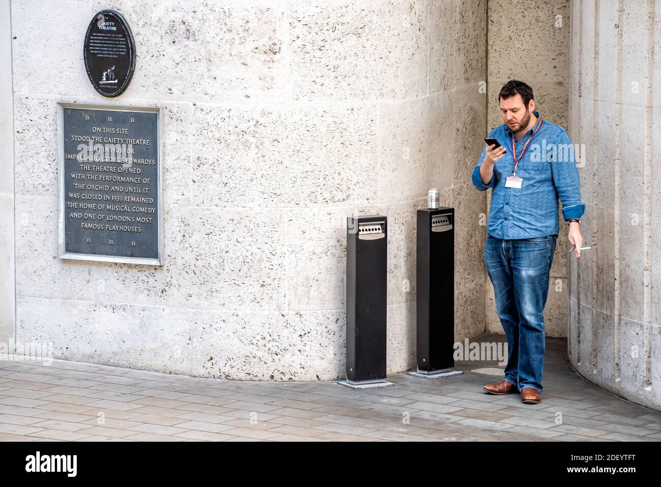 Standing cigarette pavement break hi-res stock photography and images ...
