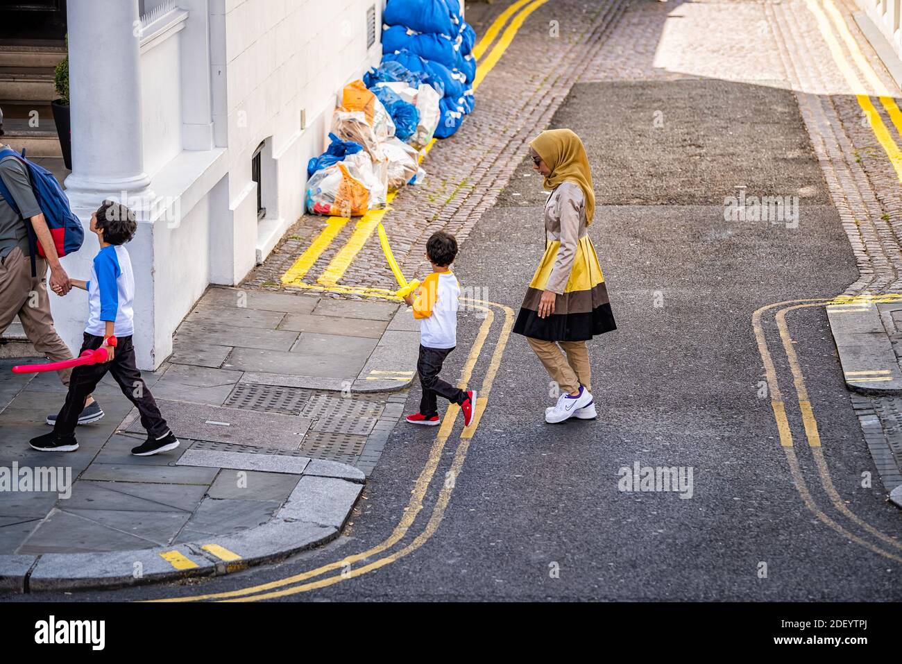 London, UK - June 22, 2018: People arab muslim family walking with ...