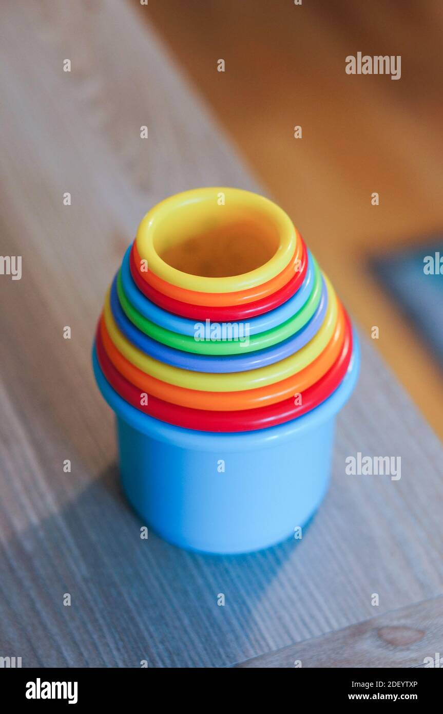 A vertical selective focus shot of plastic toy cups pyramid Stock Photo ...