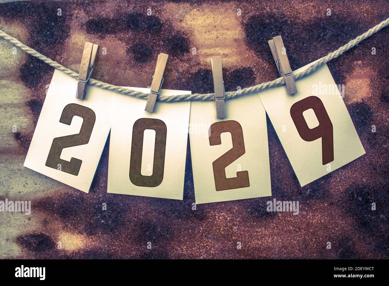 The year 2029 written on pinned cards against an old rusty background ...