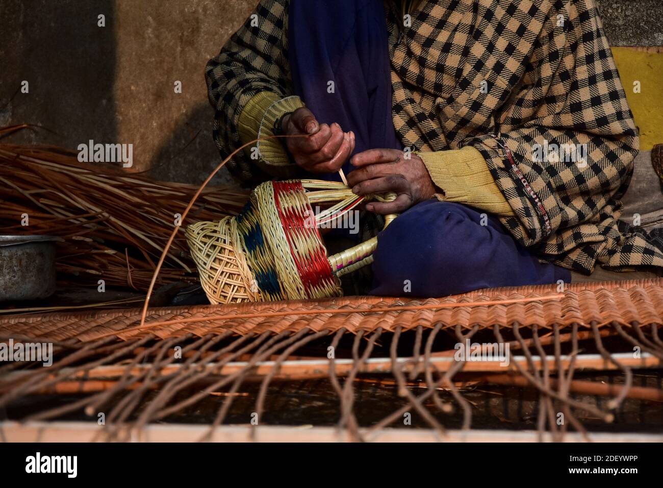 Srinagar, India. 02nd Dec, 2020. A Kashmiri man makes a "Kangri", a ...