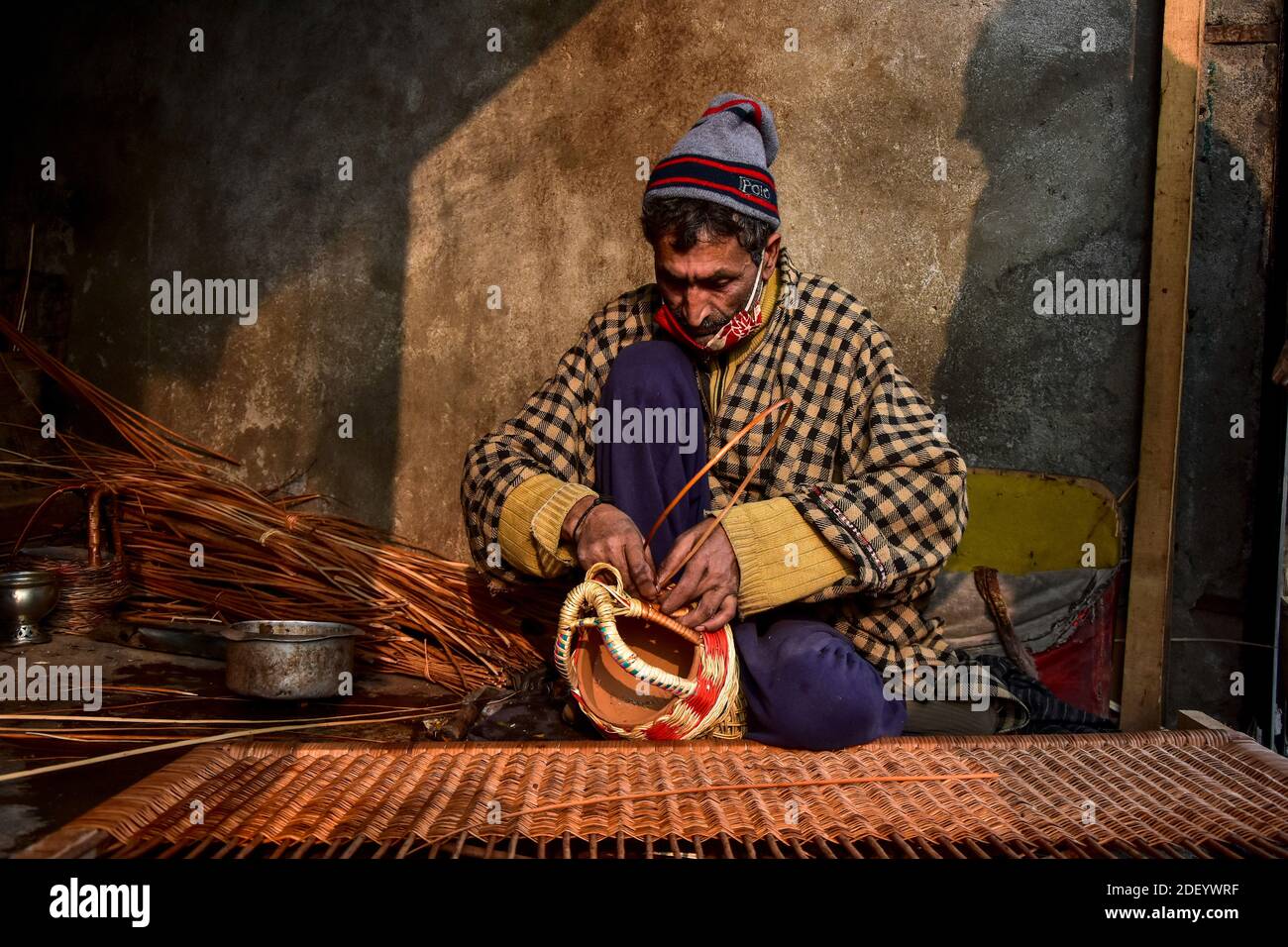 Srinagar, India. 02nd Dec, 2020. A Kashmiri man makes a "Kangri", a ...