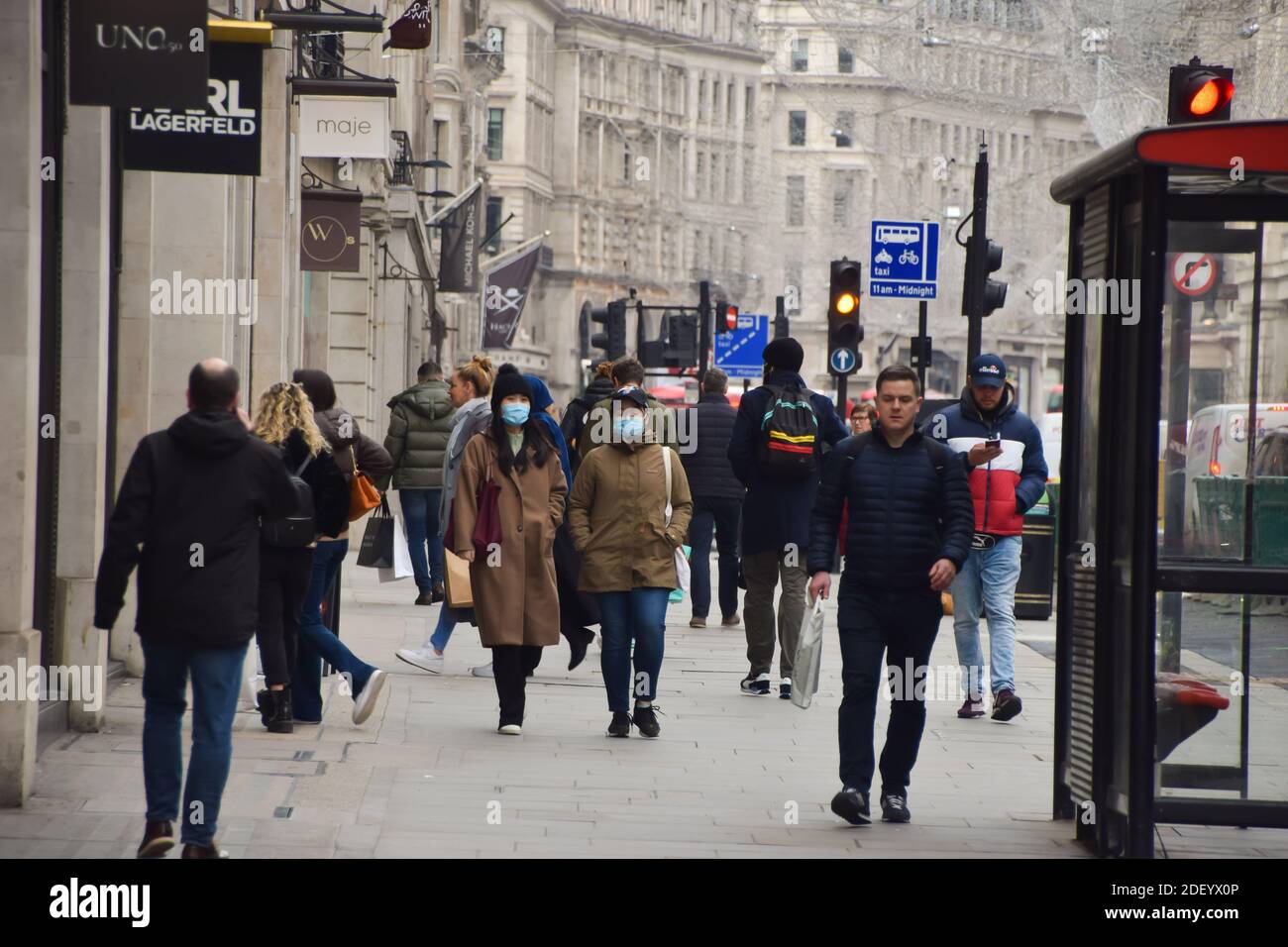 People wearing protective face masks on Regent Street, London on the ...