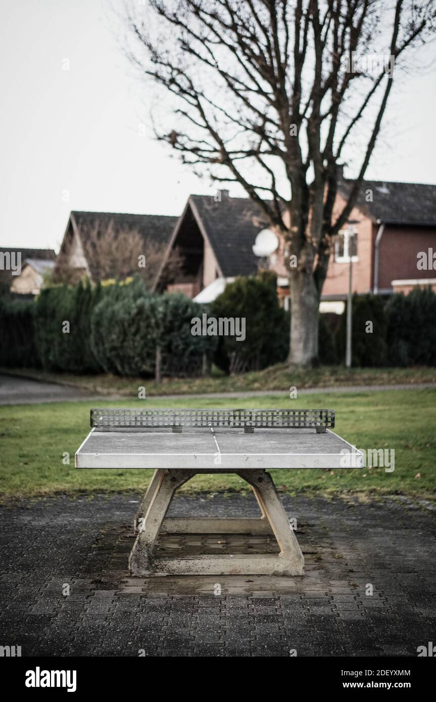 A vertical shot of a ping-pong table near the houses Stock Photo - Alamy