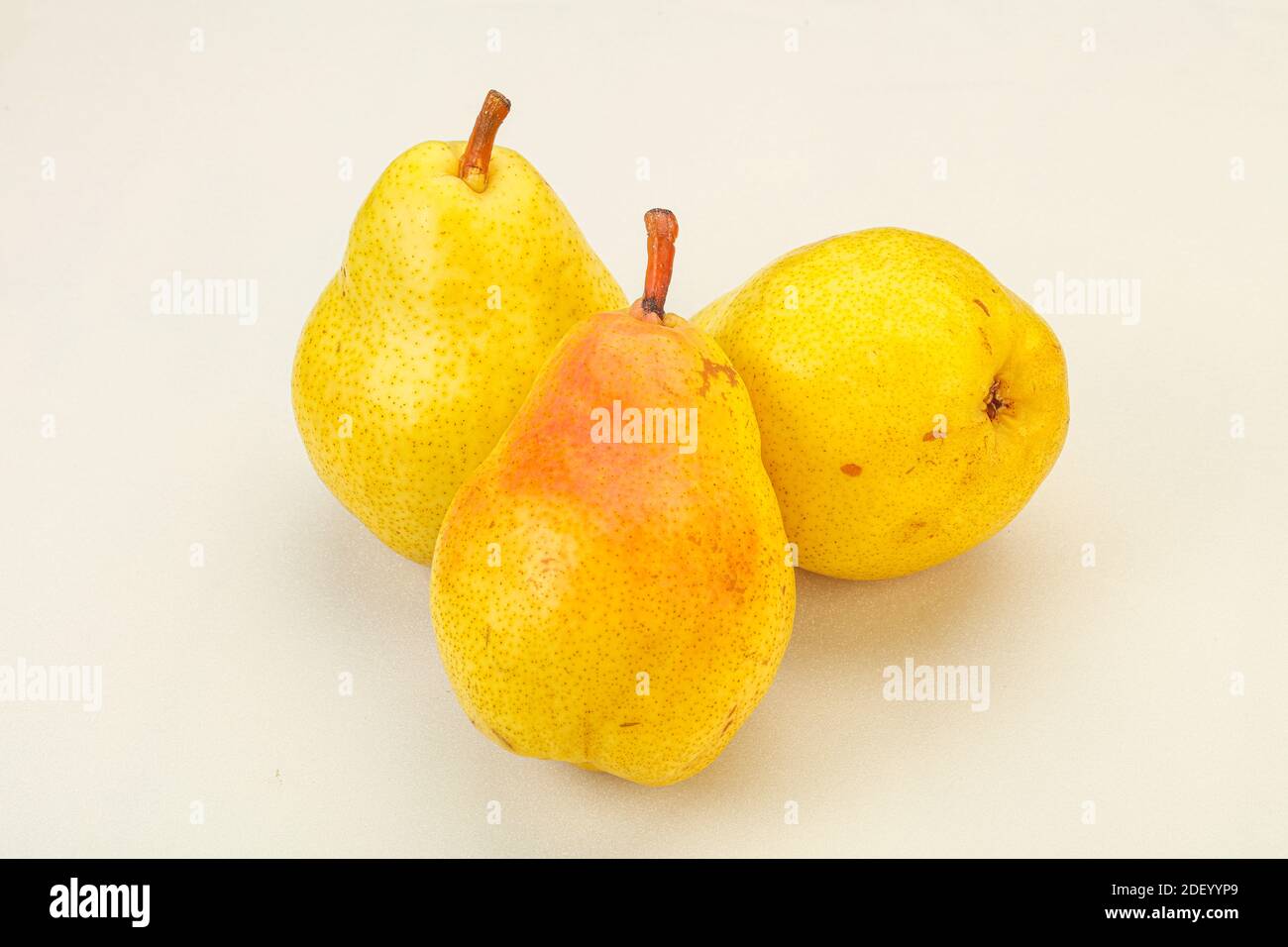 Fresh sweet yellow pear over background Stock Photo - Alamy