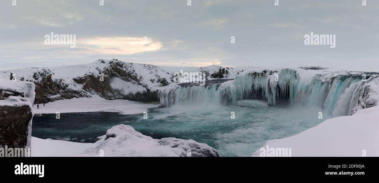 Iced Godafoss waterfall with some visitors for scale Stock Photo - Alamy