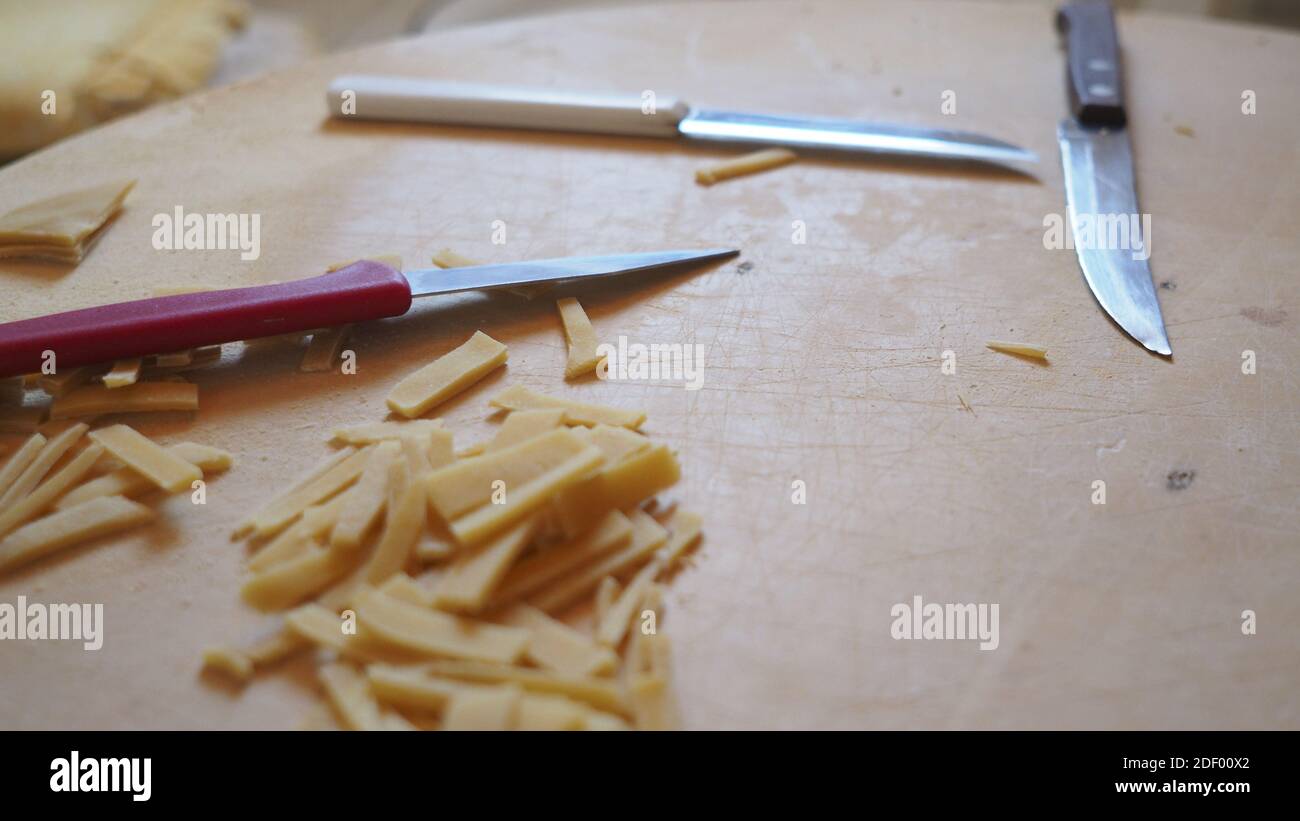 A closeup of dough slices in pasta making process Stock Photo - Alamy