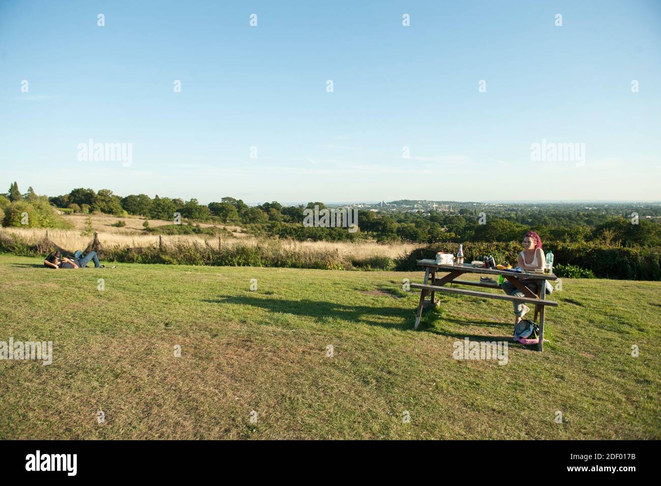People enjoying evening sun at Harrow View Point Stock Photo - Alamy