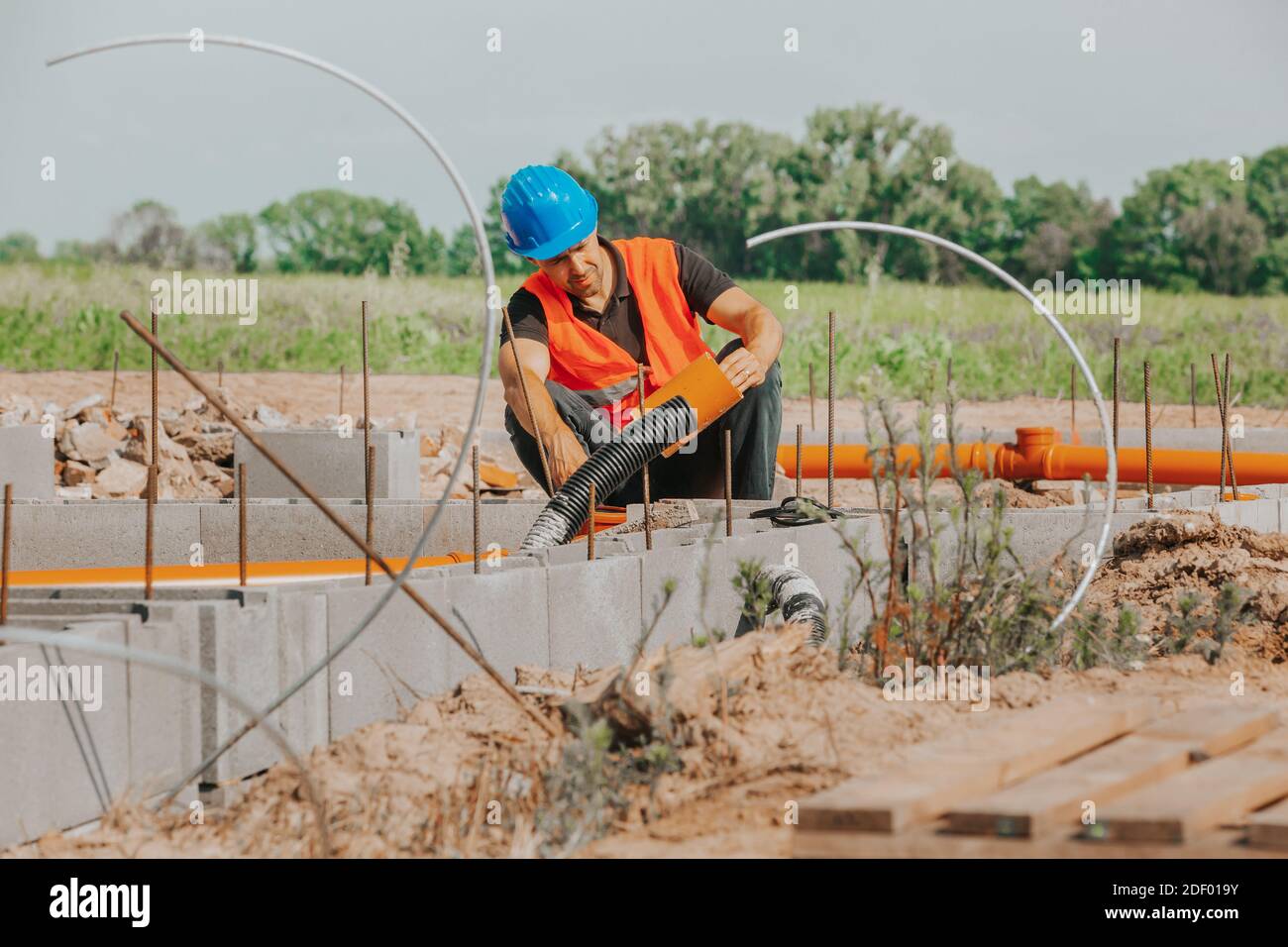 Builder checking his buildings or foundation of the house, contruction ...