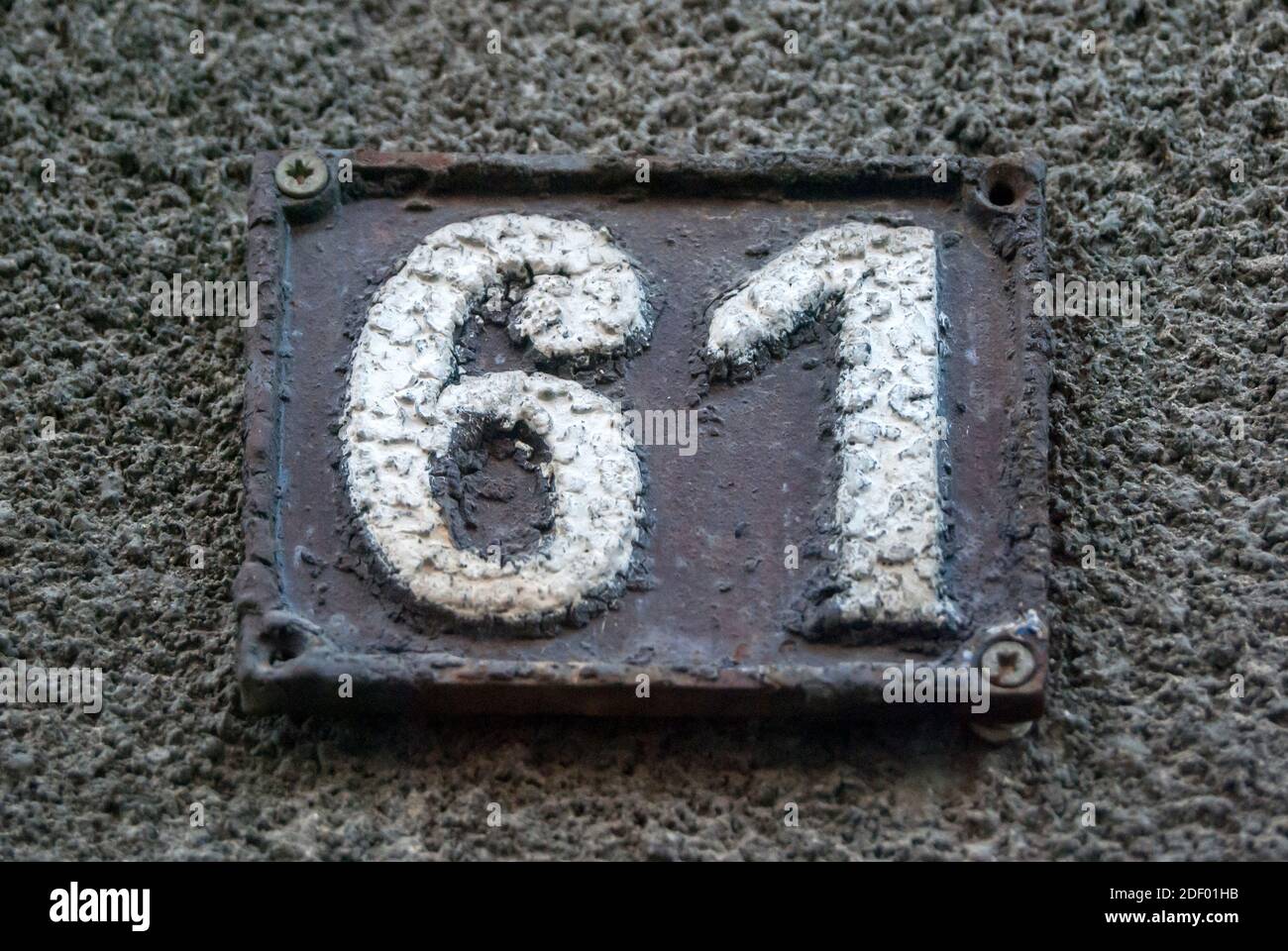 Old retro weathered cast iron plate with number 61 closeup Stock Photo ...