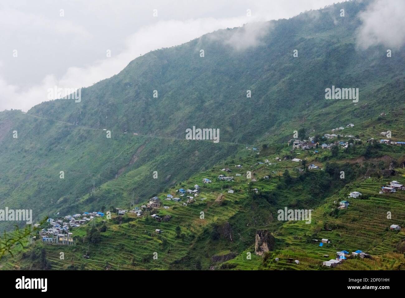 Village in the lush valley in southern Himalayas, Rasuwa District ...