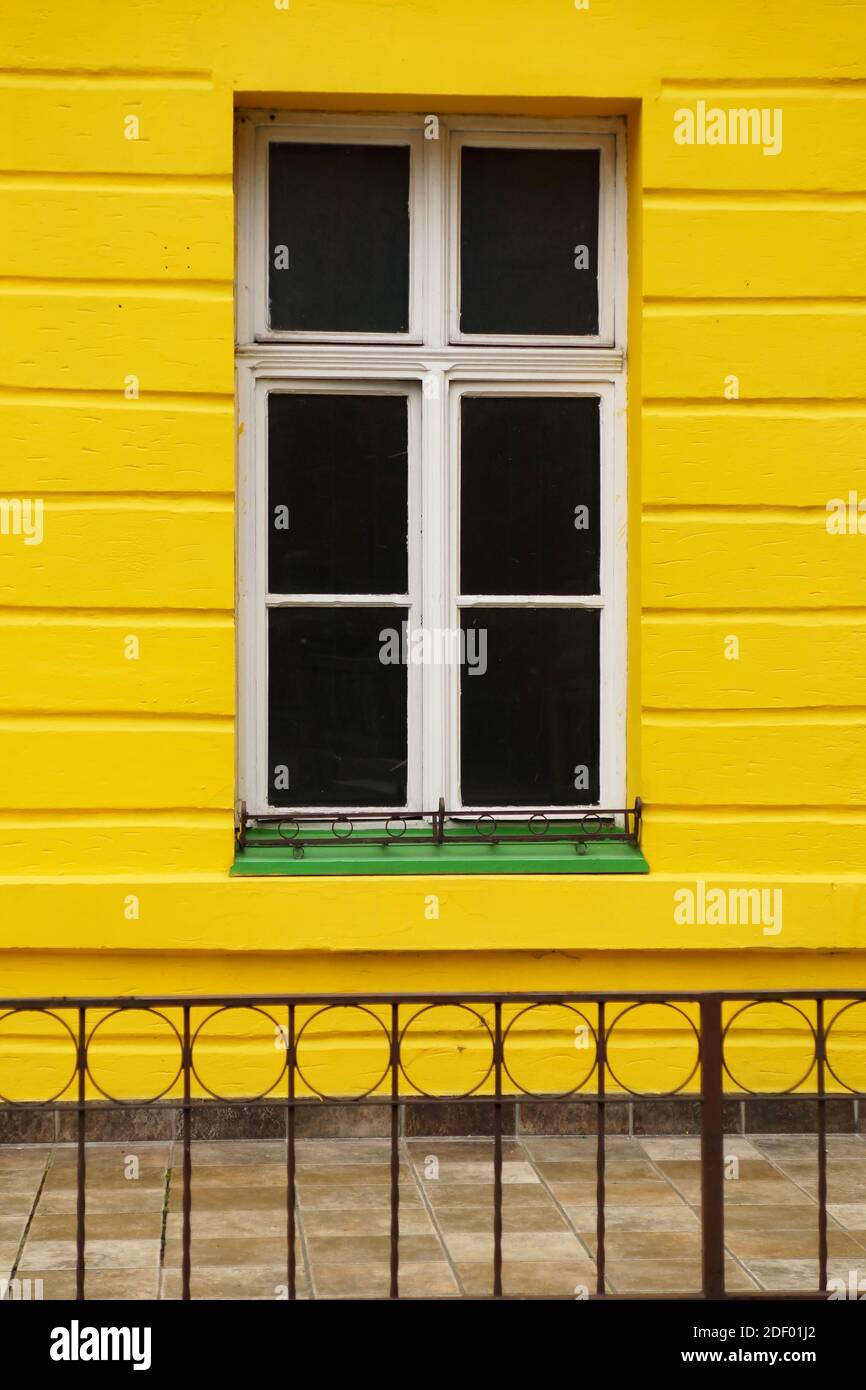 A classic window of a yellow wooden house Stock Photo - Alamy