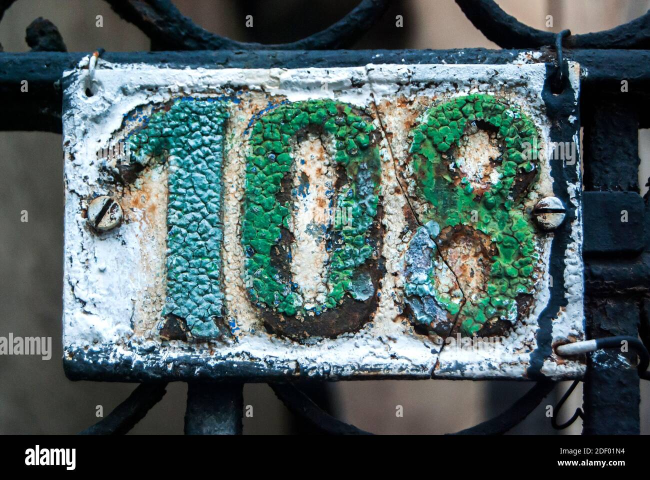Old retro weathered cast iron plate with number 108 closeup Stock Photo ...