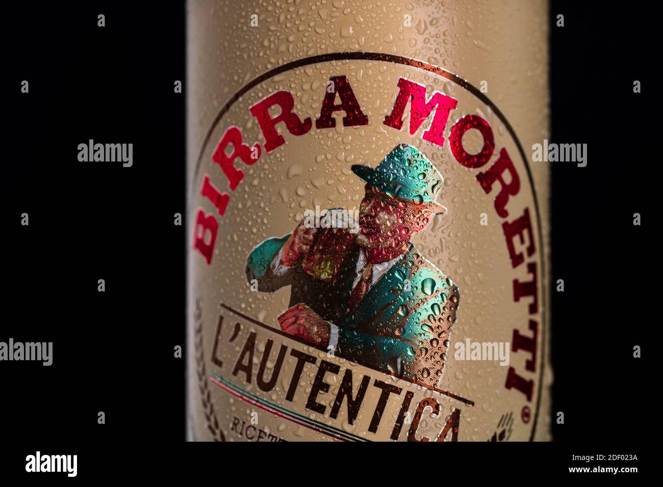 Birra Moretti, a premium lager beer with water droplets on black ...