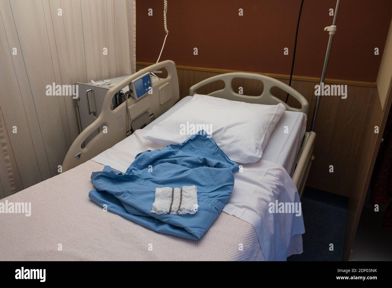 A Blue medical operation shirt and white operation underware lying on a ...