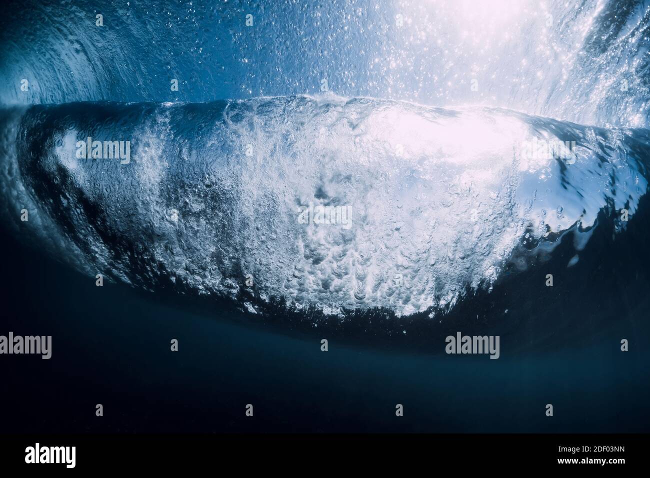 Breaking wave with foam and bubbles underwater. Transparent ocean water ...