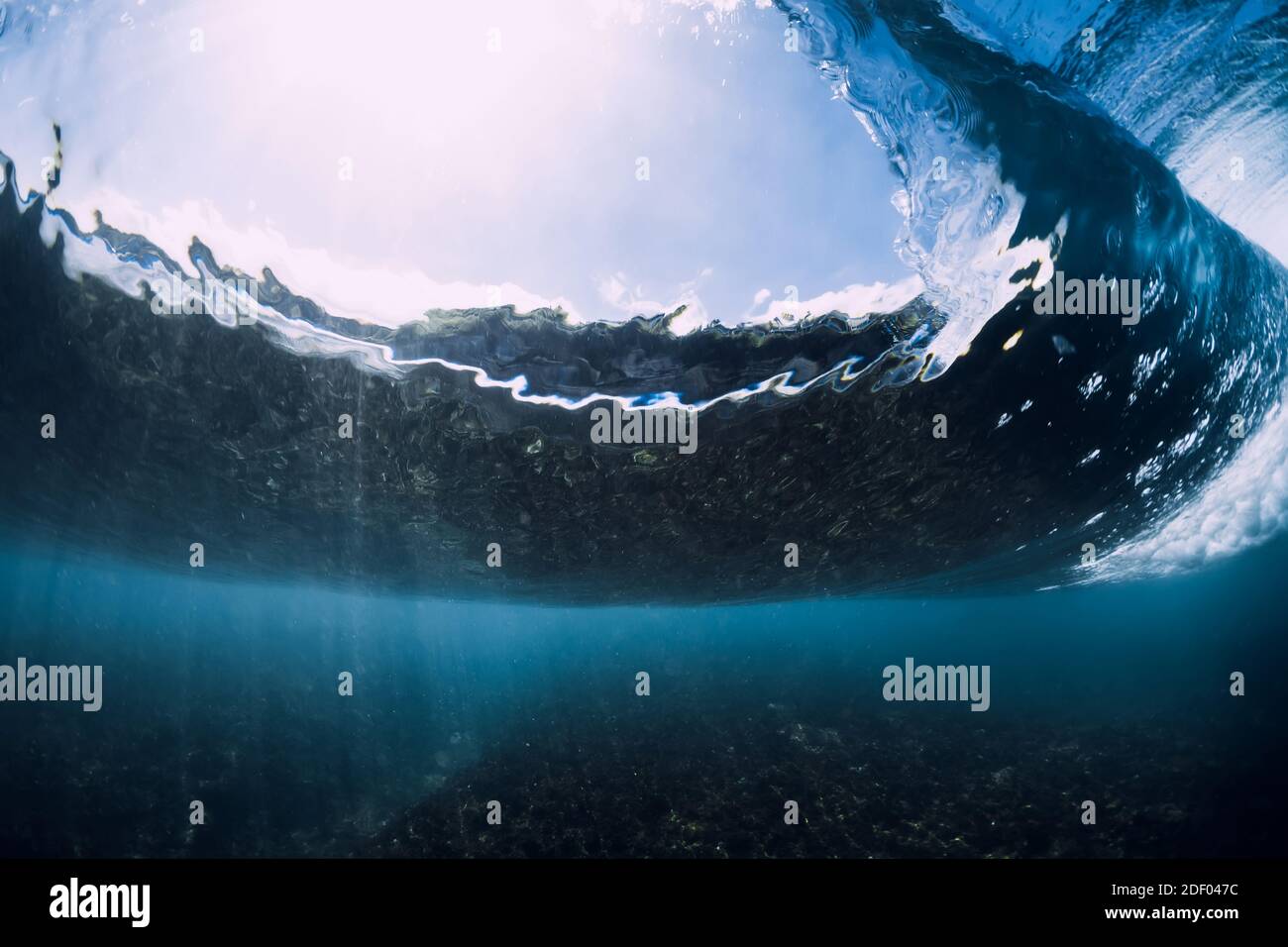 Breaking wave with foam and bubbles underwater. Transparent ocean water ...