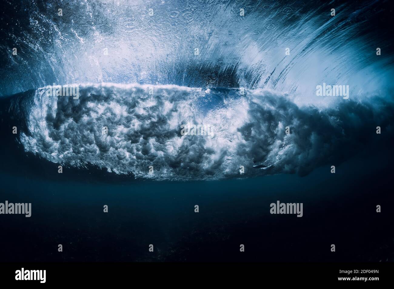 Breaking wave with foam and bubbles underwater. Transparent ocean water ...