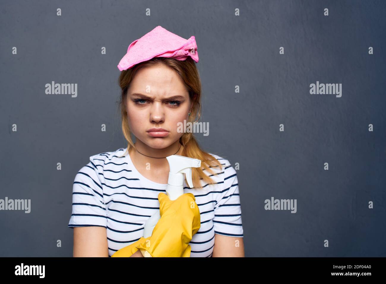 Cleaning lady with detergent pink rag service lifestyle cropped view ...