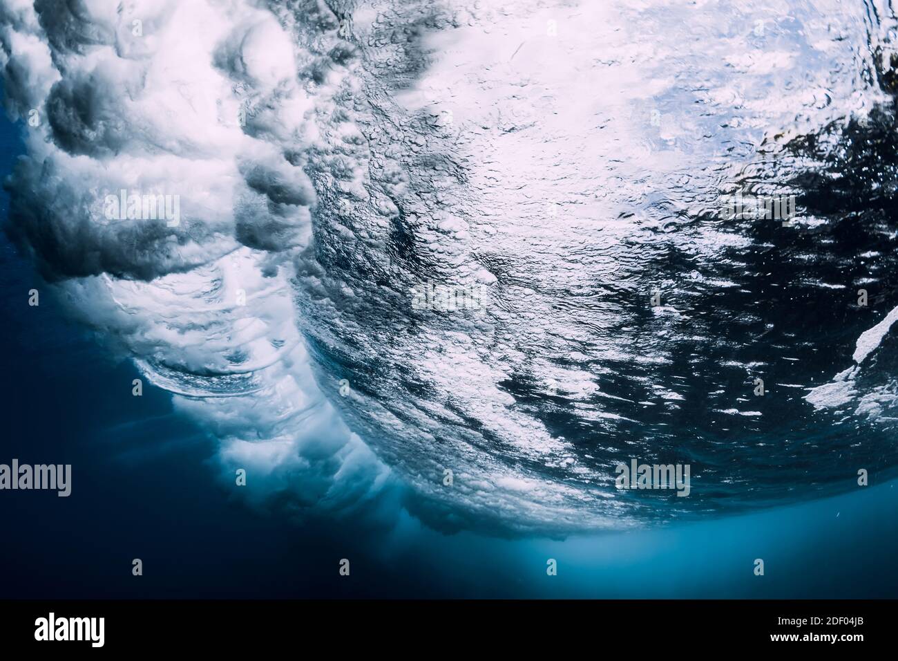 Breaking wave with foam and bubbles underwater. Transparent ocean water ...