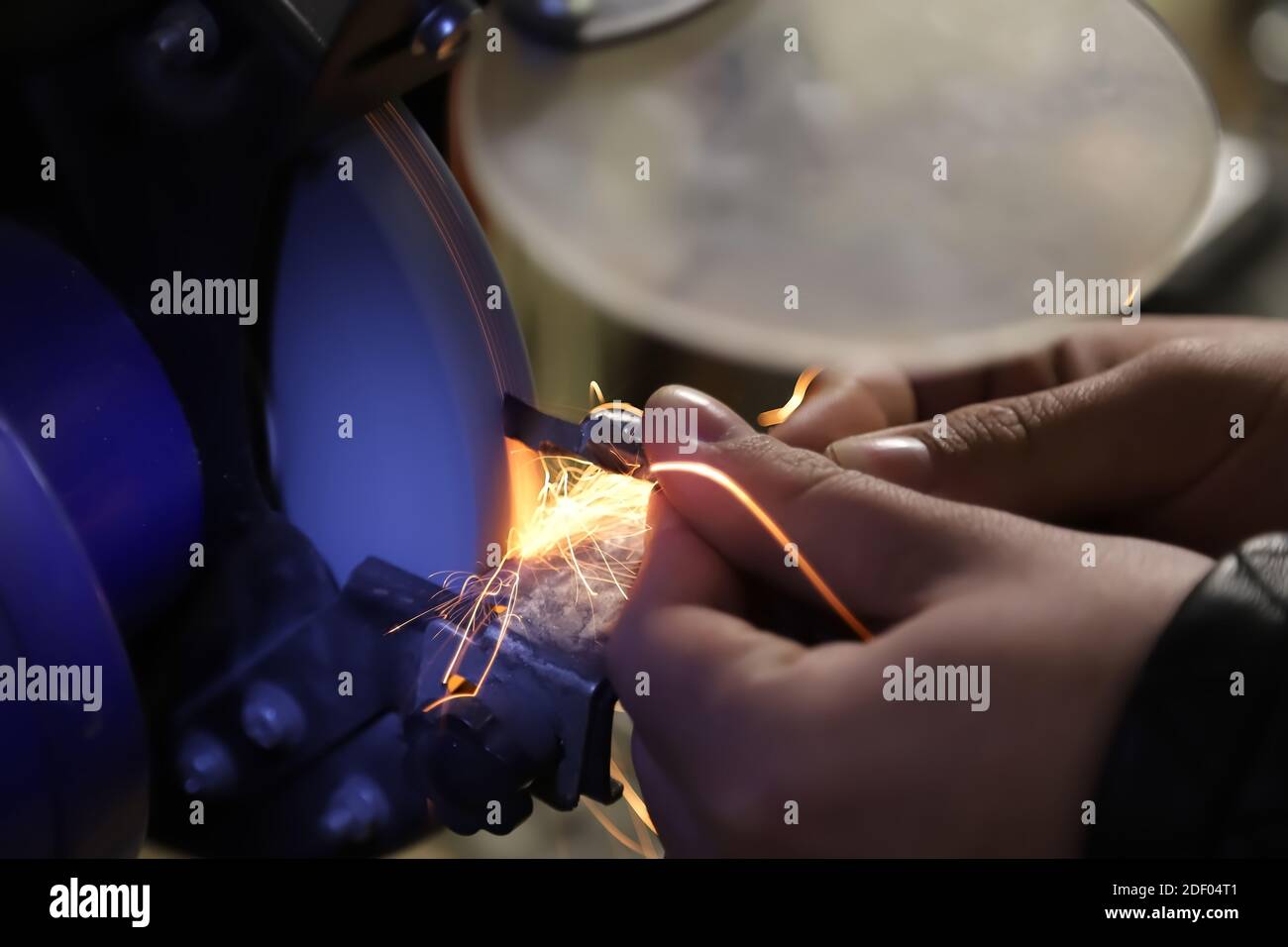 mechanic at work with a grinder Stock Photo - Alamy