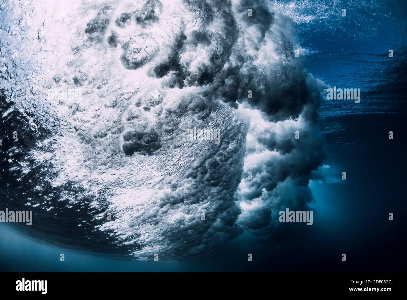 Breaking wave with foam and bubbles underwater. Transparent ocean water ...