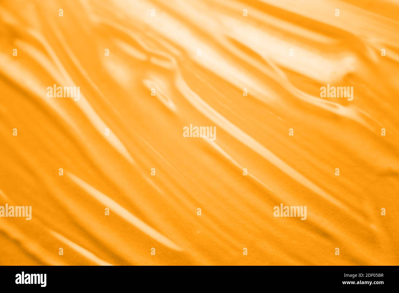 Abstract texture. Liquid gel cosmetics. Yellow background Stock Photo ...
