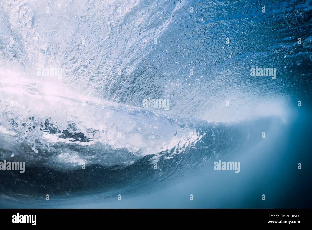 Breaking wave with foam and bubbles underwater. Transparent ocean water ...