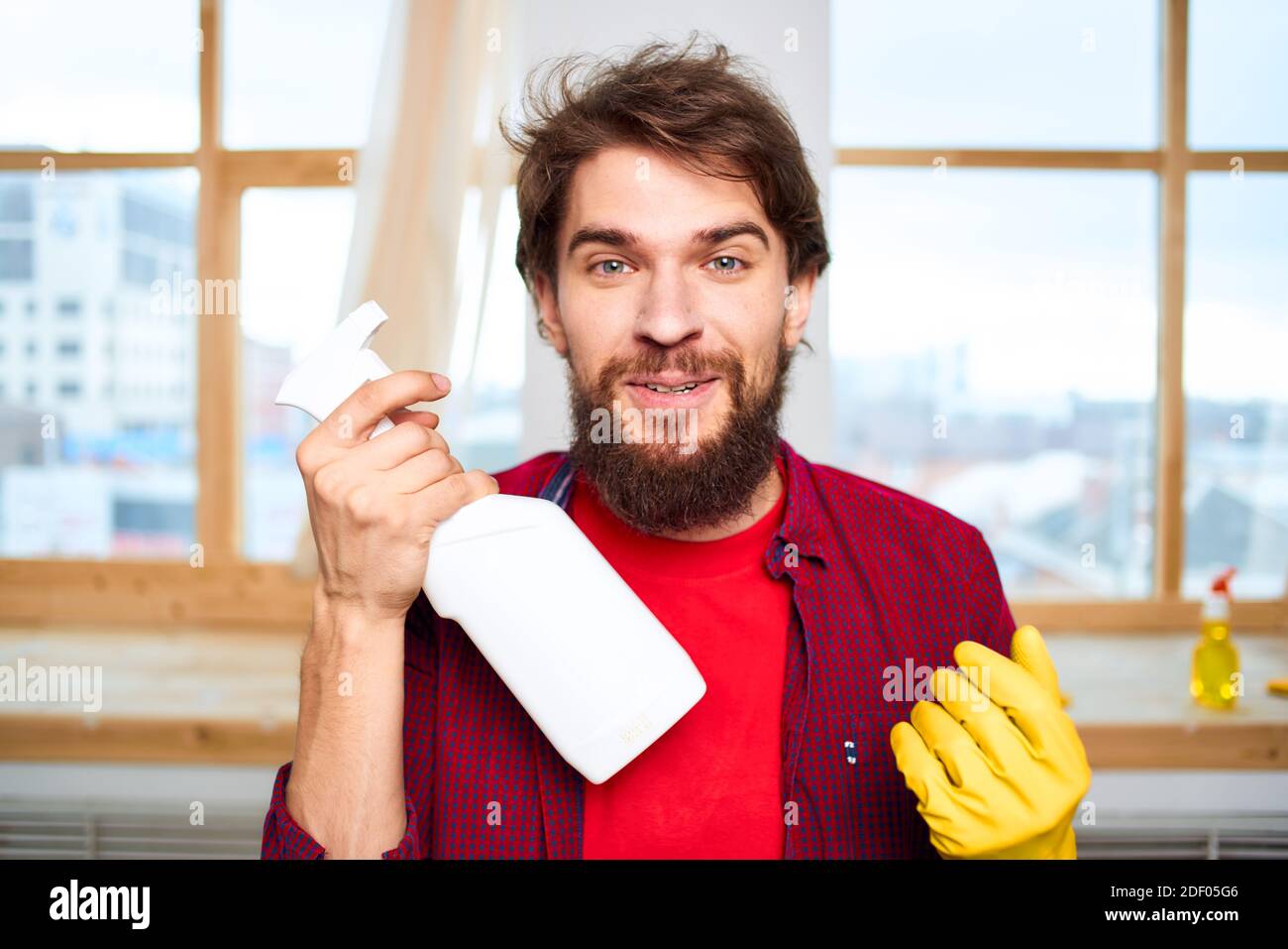 Professional janitor detergent rubber gloves interior window in the ...