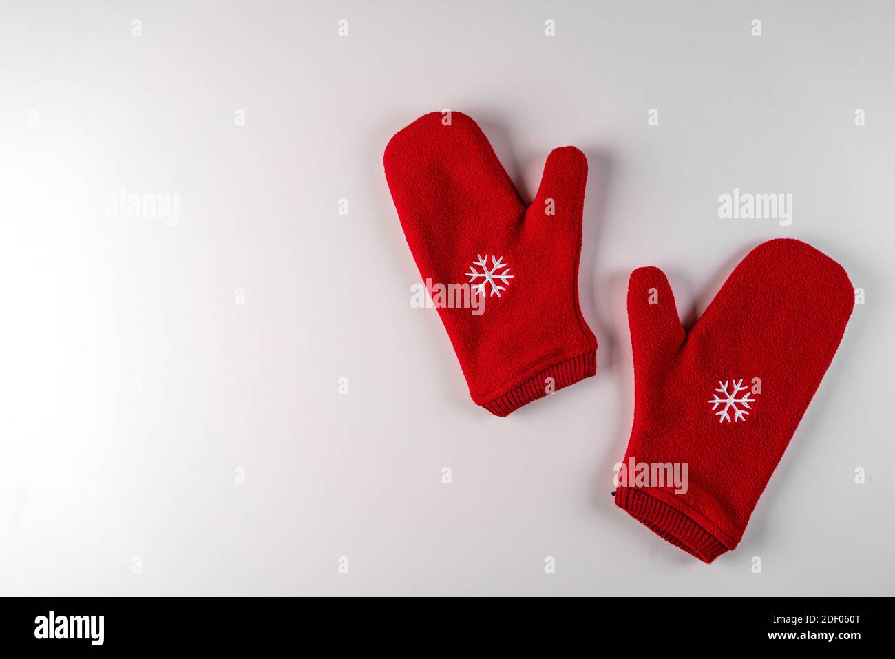 Red mittens/gloves isolated on white background Stock Photo - Alamy