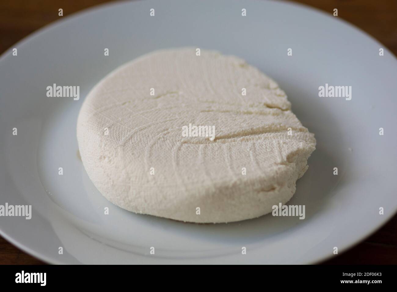 Homemade Paneer, fresh Indian cottage cheese, on a white plate Stock ...