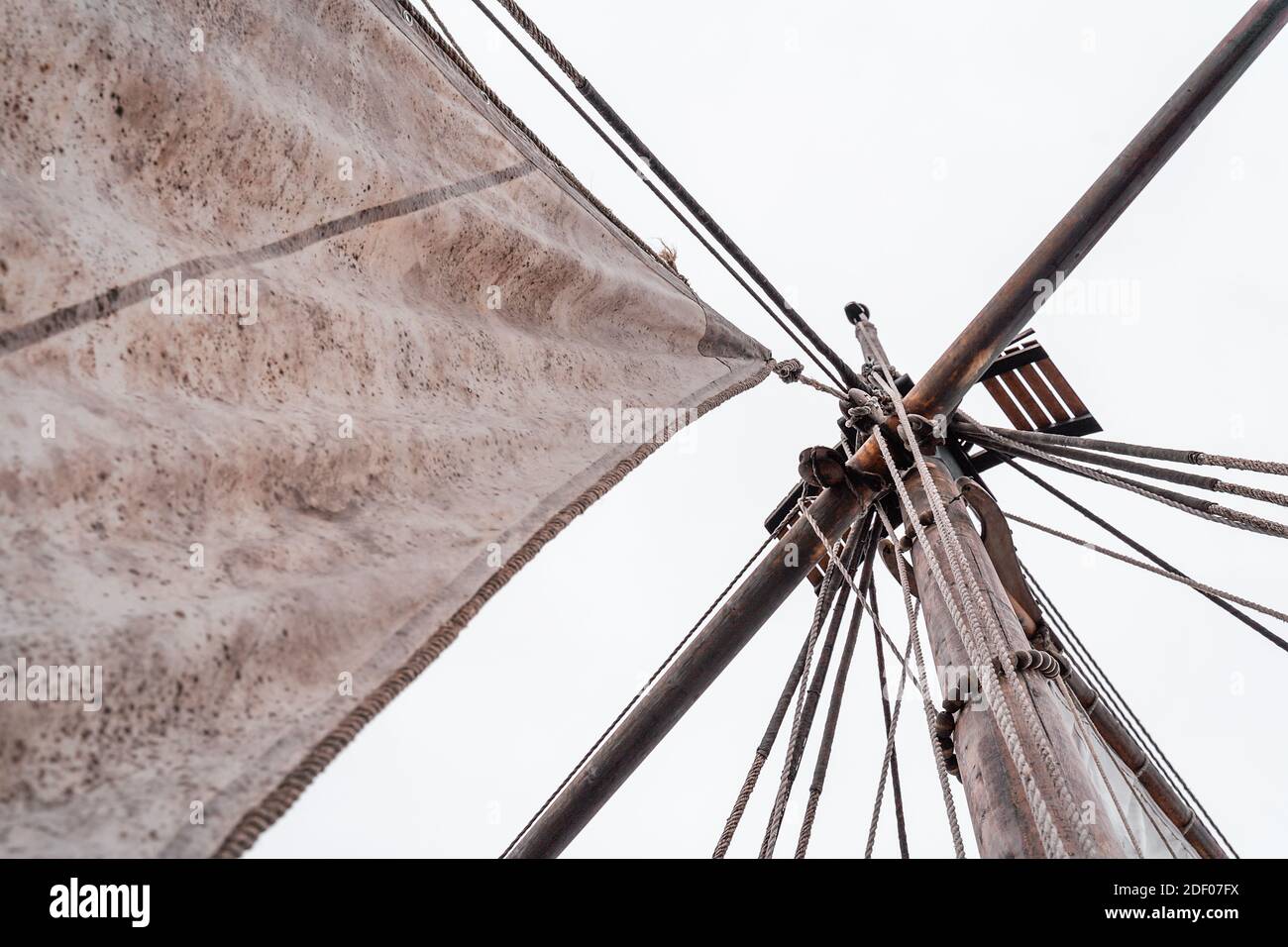Wooden old ship in vintage style with all sails set in misty lake ...