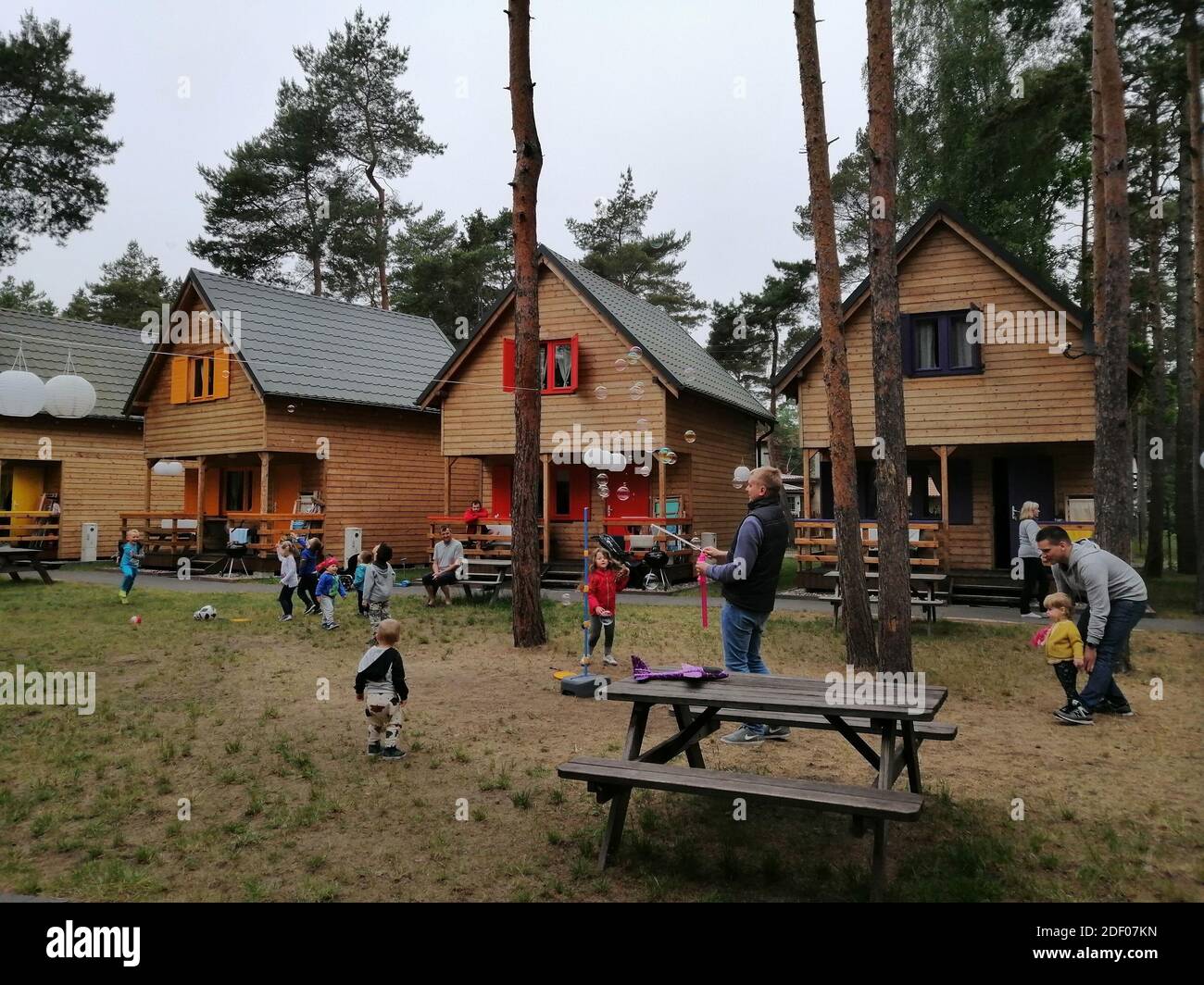 POBIEROWO, POLAND - Jun 12, 2020: Man creating soap bubbles for kids at ...