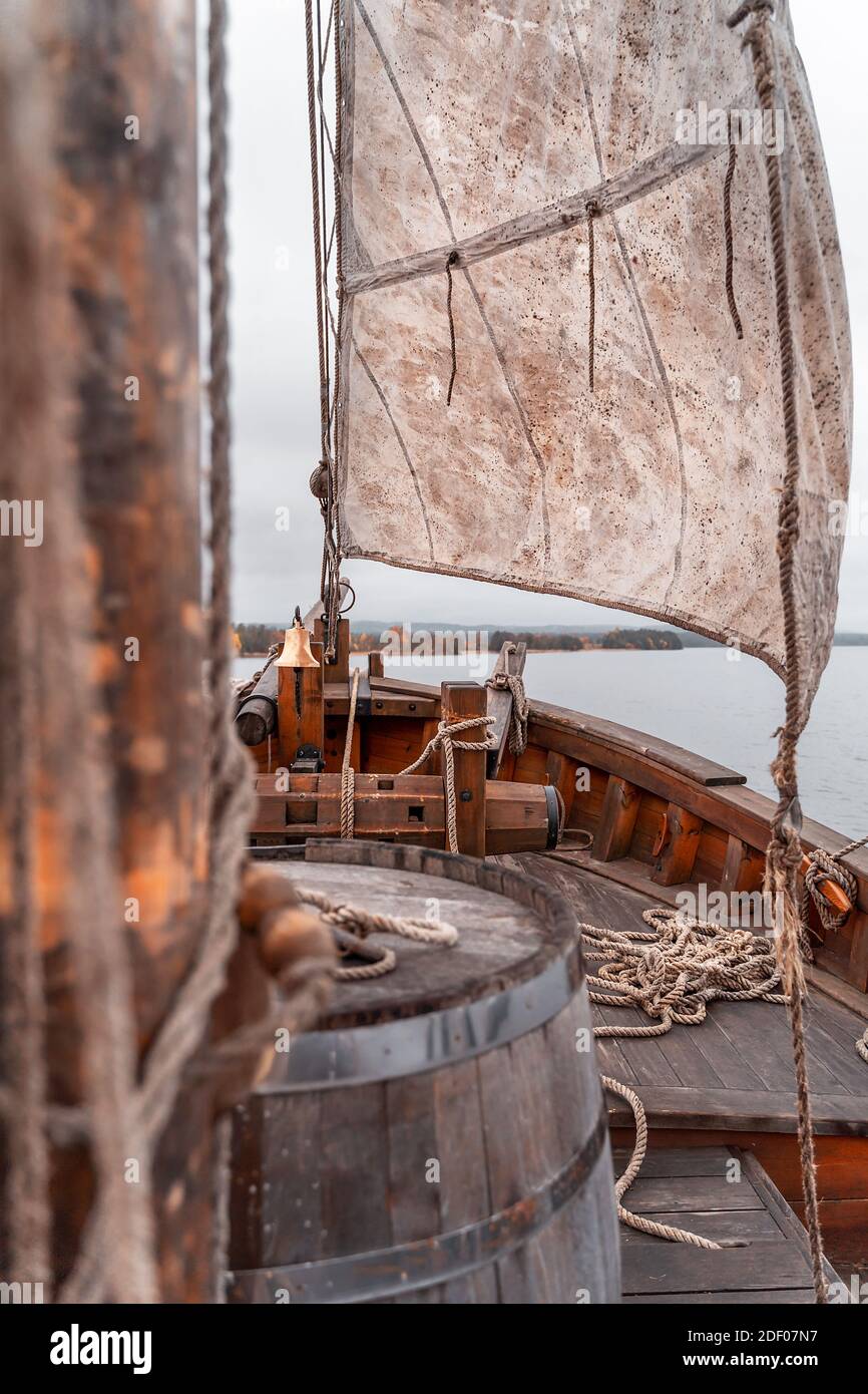 Wooden old ship in vintage style with all sails set in misty lake ...