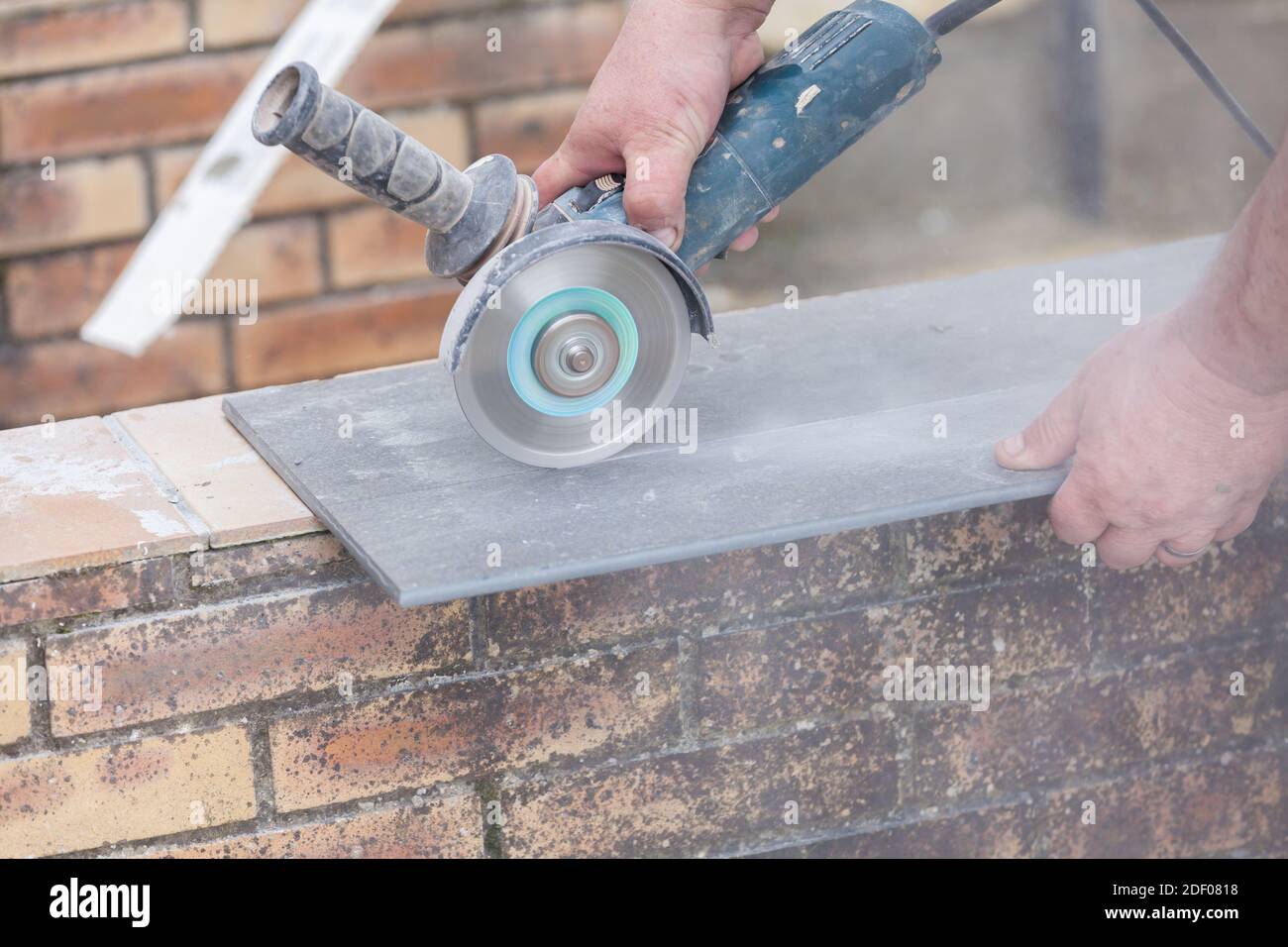 Professional tiler grinding tiles hi-res stock photography and images ...