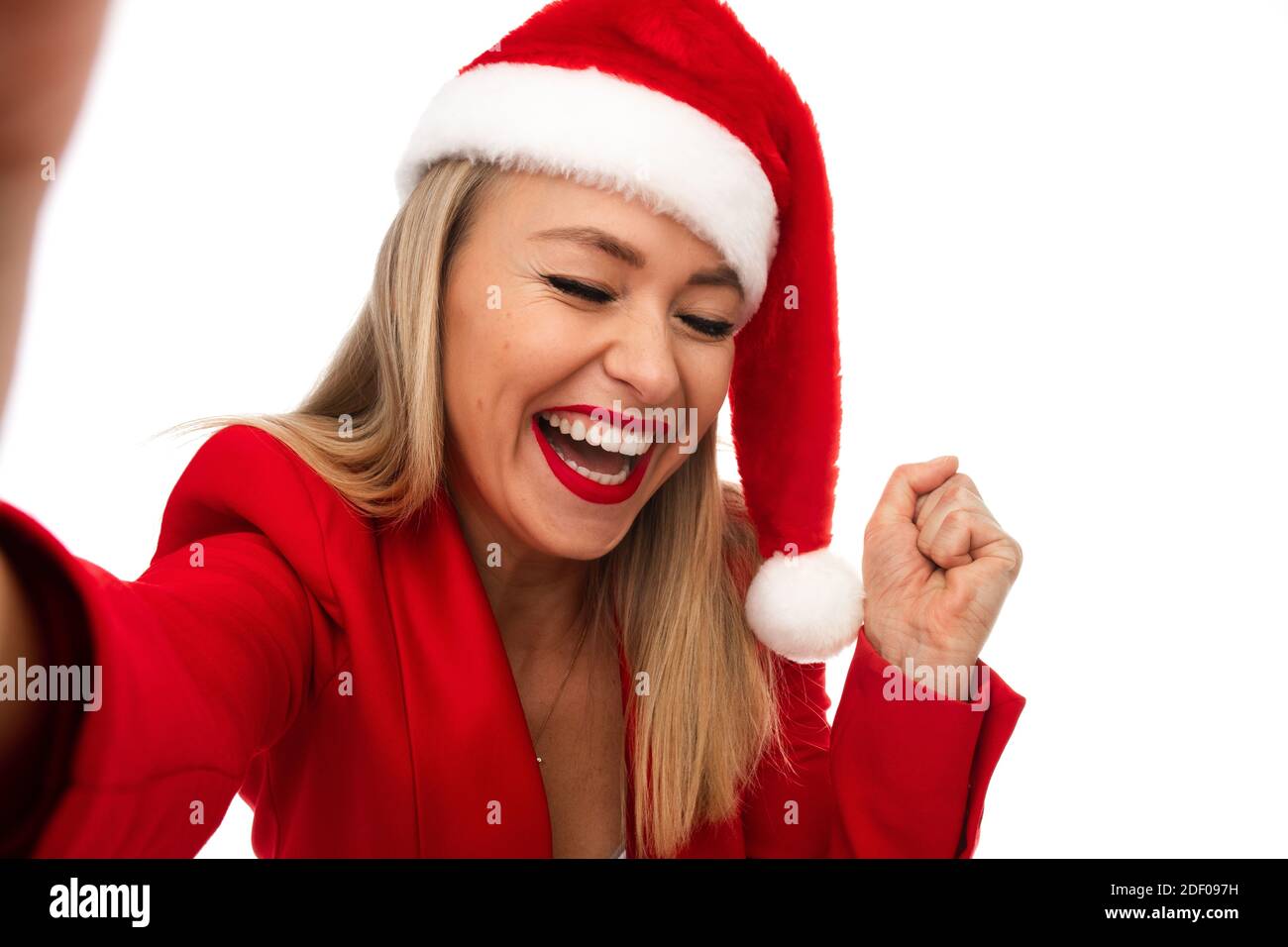 Santa girl making selfie with camera. Studio shot isolate on white ...