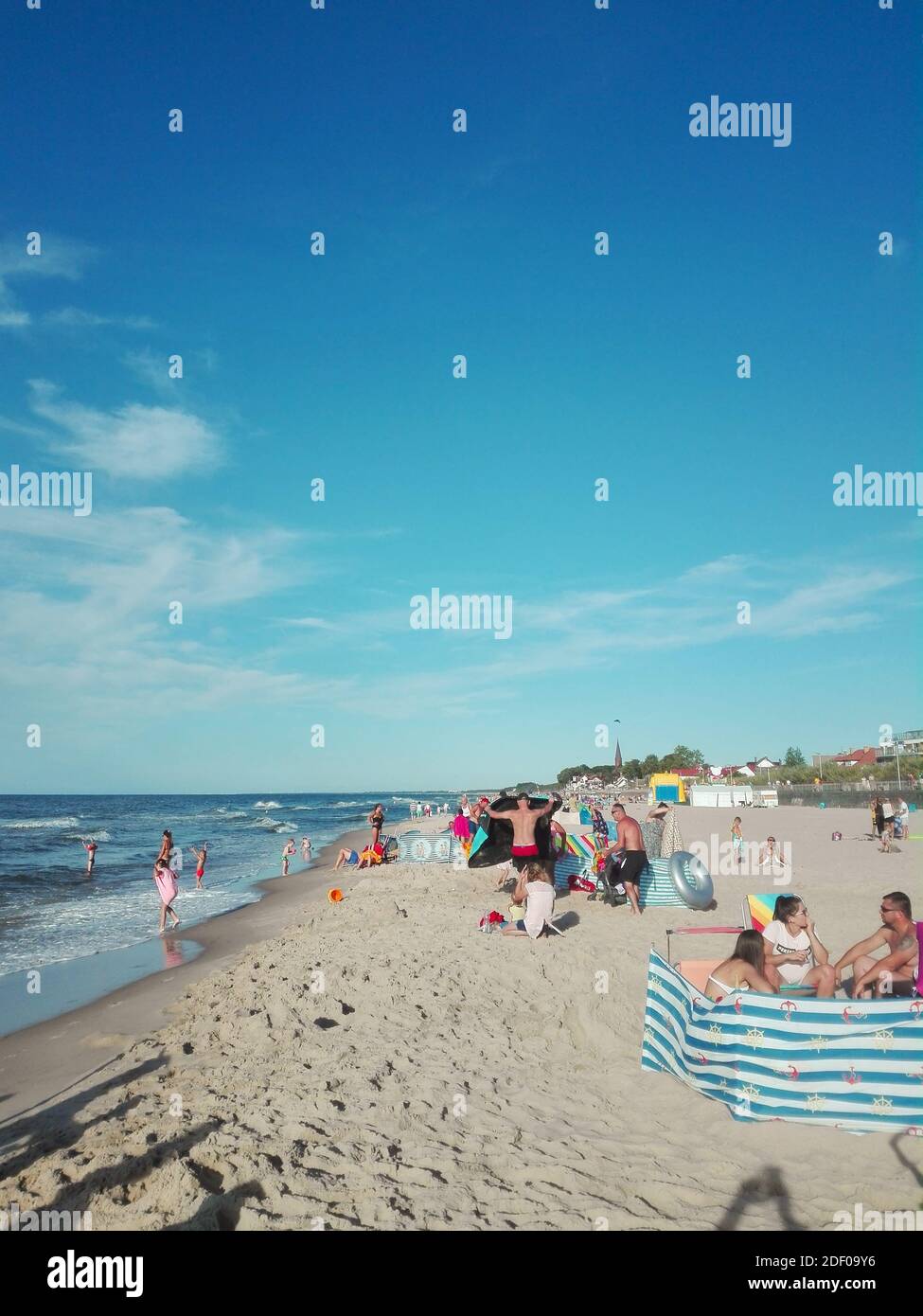 SARBINOWO, POLAND - Aug 06, 2018: Many people resting on sand by the ...