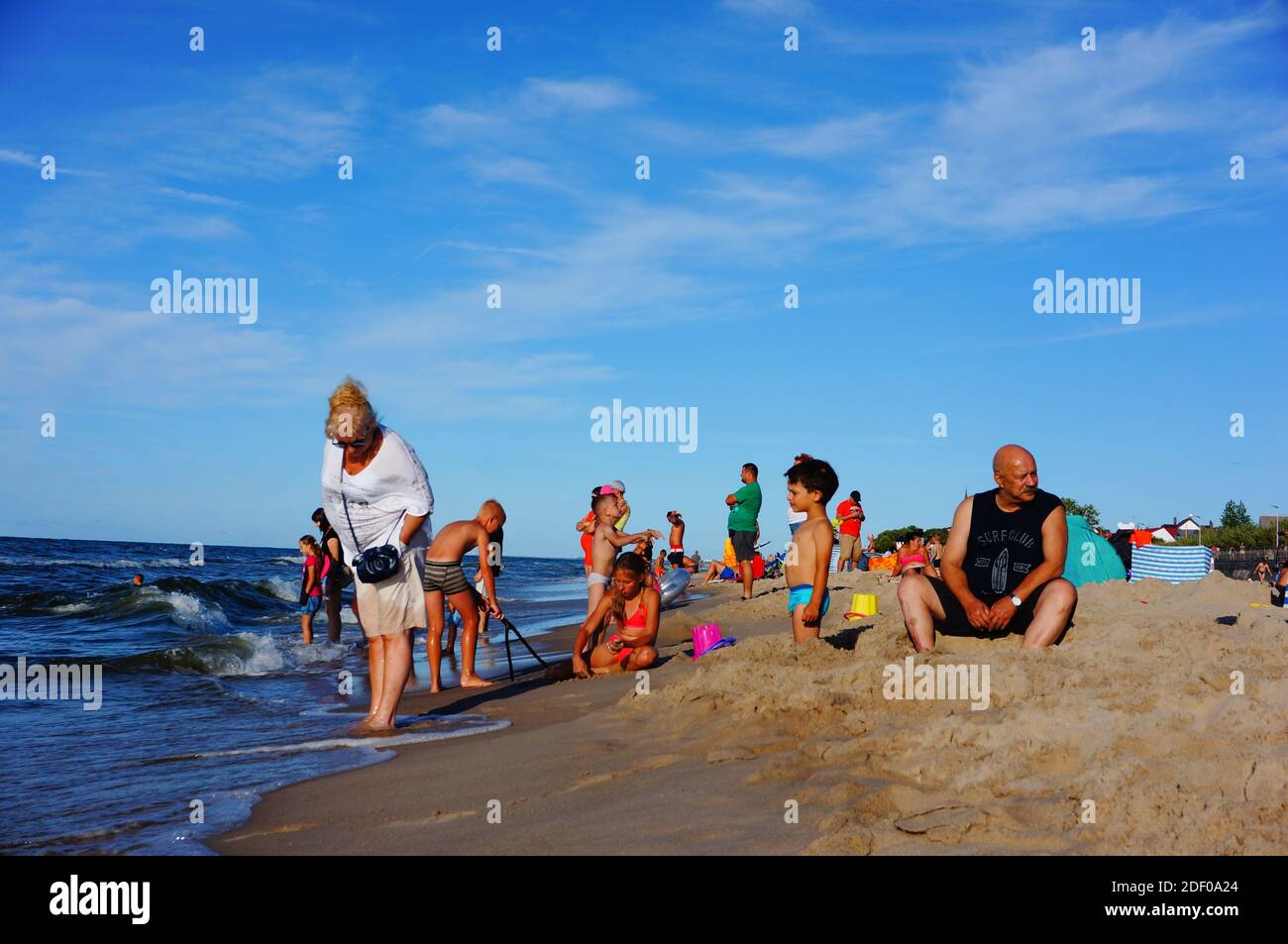 SARBINOWO, POLAND - Aug 06, 2018: People on sand at a beach in the ...