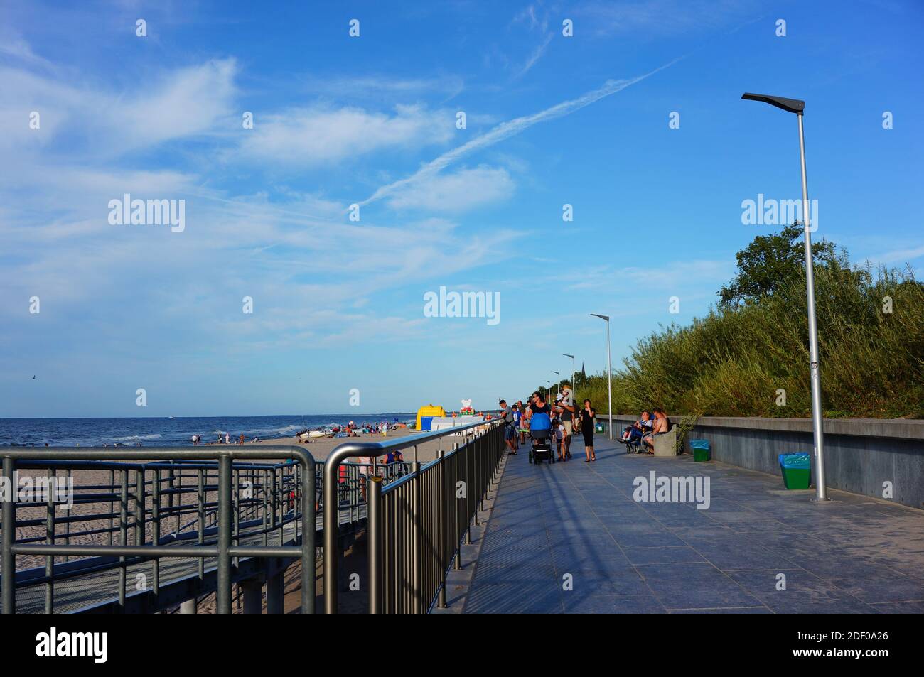 SARBINOWO, POLAND - Aug 06, 2020: People on a promenade along a beach ...