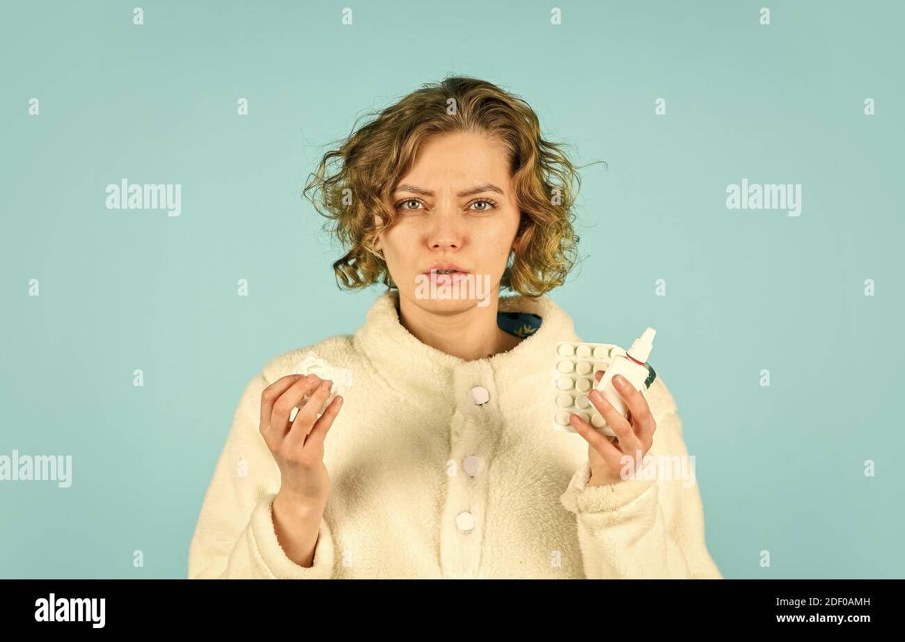 nCoV strain. female health concept. woman with cold flu use nasal spray ...