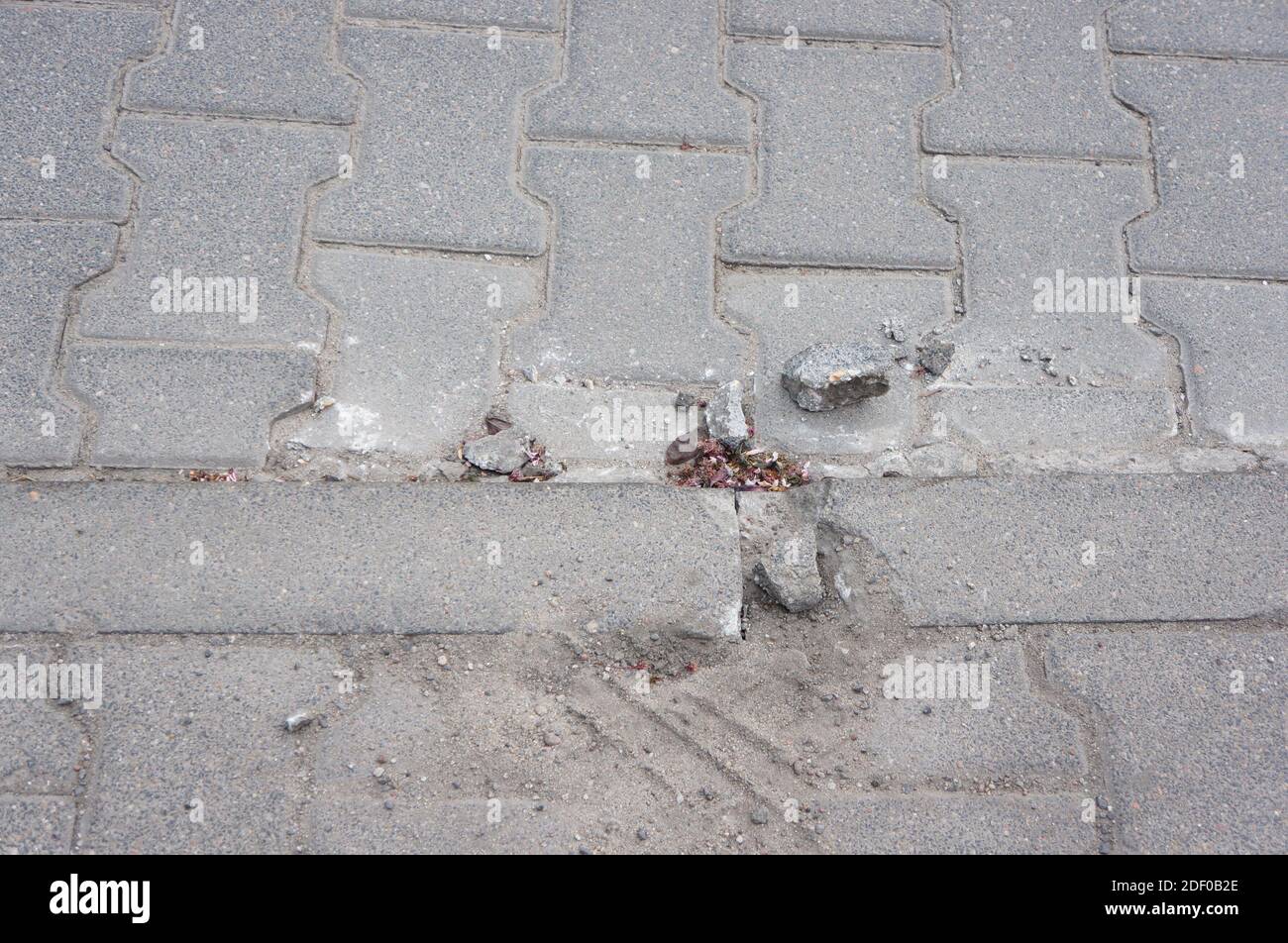 A top view of a concrete block street with chipped off parts Stock ...
